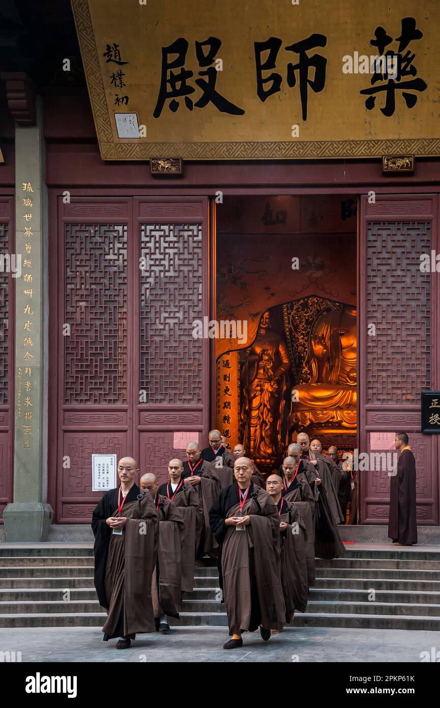 Devout monks leaving a temple, Lingying Monastery, Xihu, Hangzhou ...