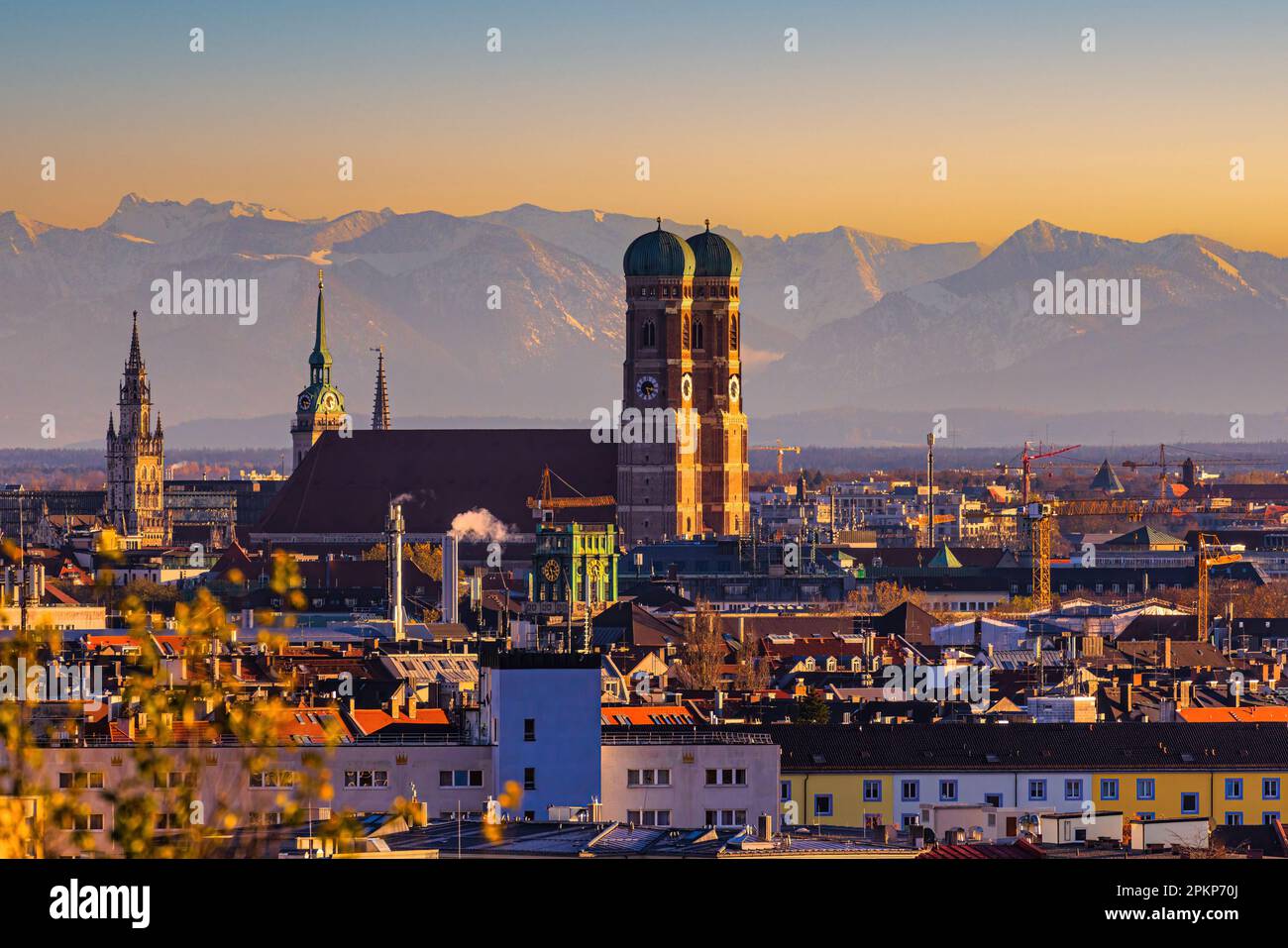 Famous Munich Skyline with Alps Stock Photo - Alamy