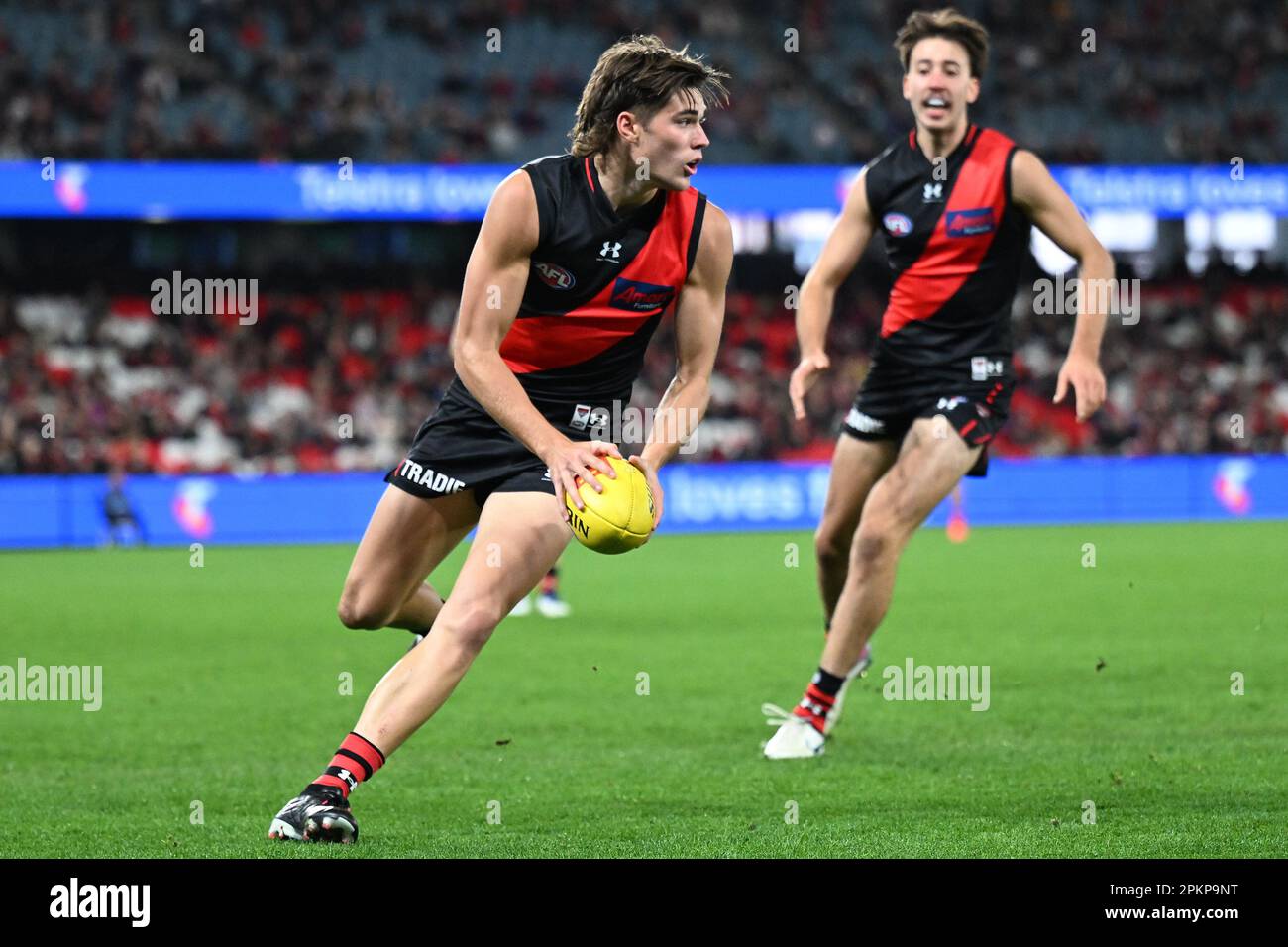 Sam Durham of Essendon (left) in action during the AFL Round 4 match ...