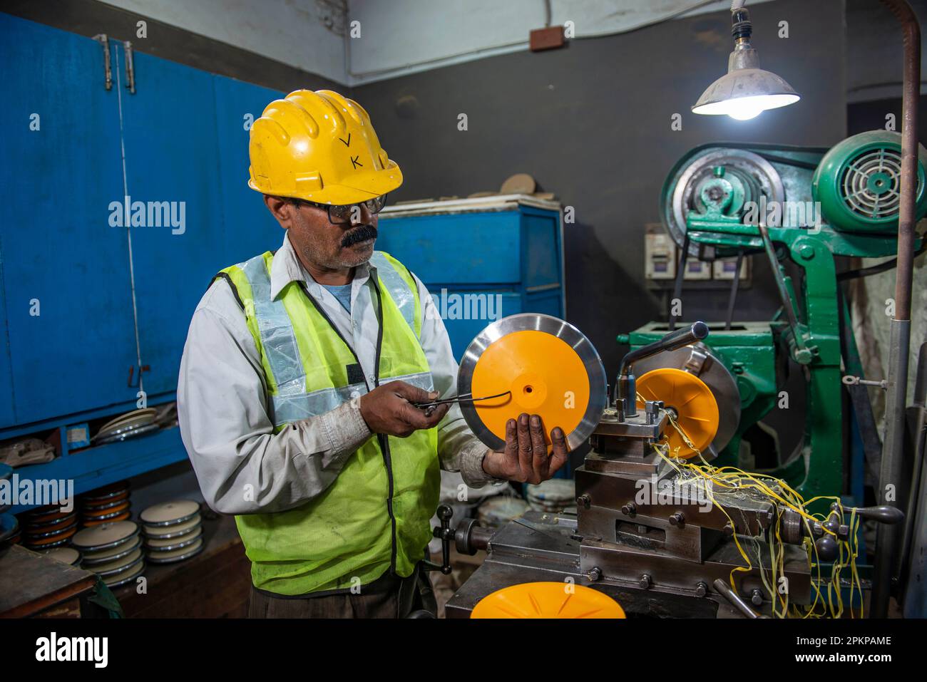 Meerut, India. 08th Apr, 2023. A technician seen measuring plastic ...