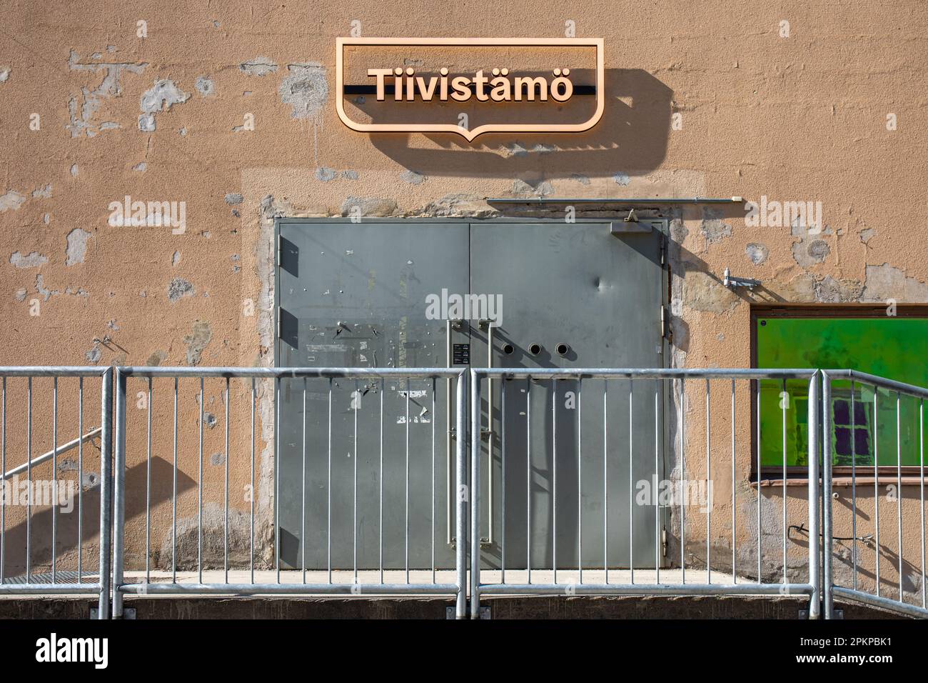 Neon light and entrance of Tiivistämö event venue in Suvilahti district ...
