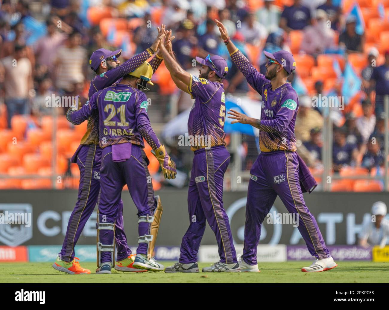Kolkata Knight Rider players celebrate the dismissal of Gujarat Titans ...