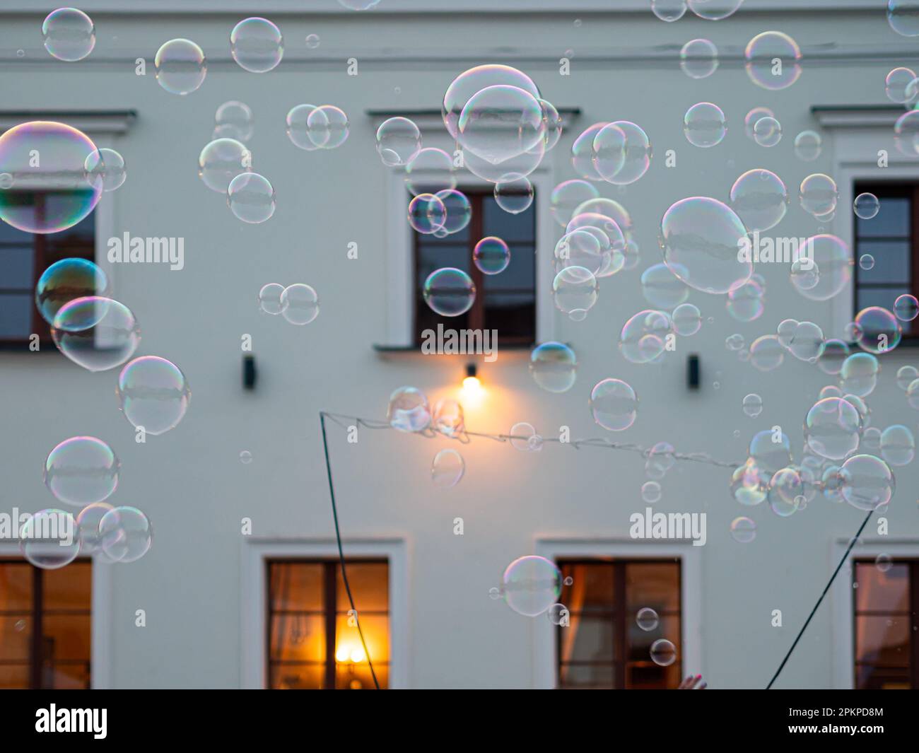 A soap bubbles show in the old town square Kazimierz Dolny, Poland ...
