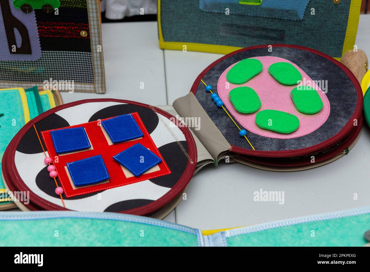 Handmade textile book for baby playing and development Stock Photo - Alamy