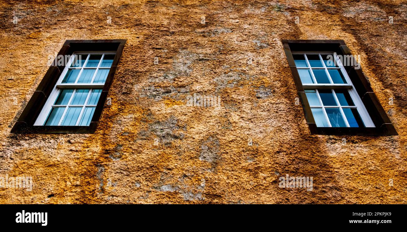 Rugged wall and windows on a building near the harbour in Lerwick ...