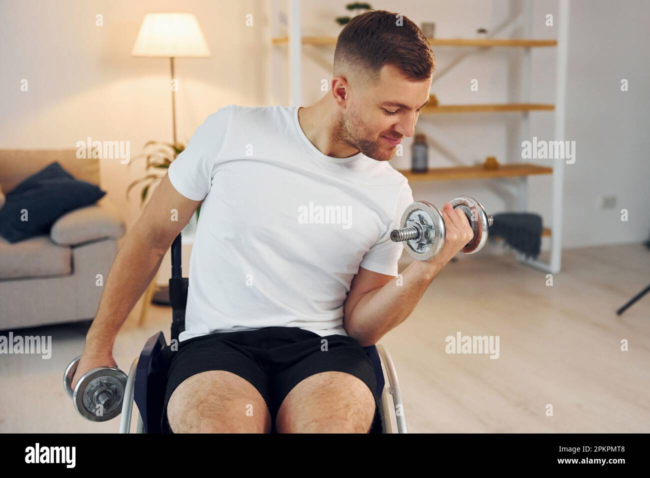 Lifting dumbbells disabled man hi-res stock photography and images - Alamy