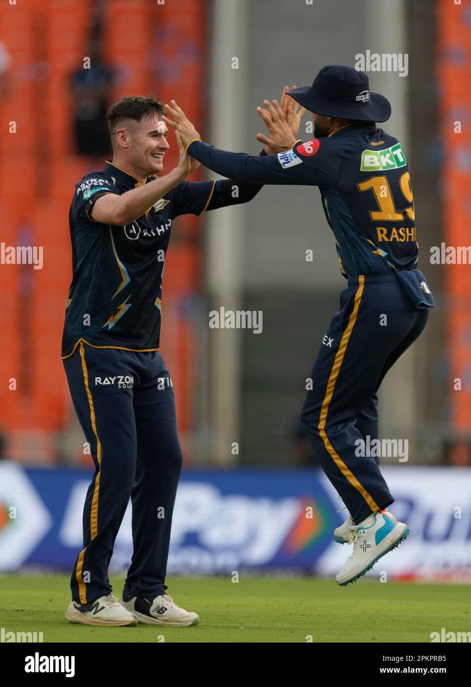 Gujarat Titan's Josh Little, left, celebrate with his teammate Rashid ...