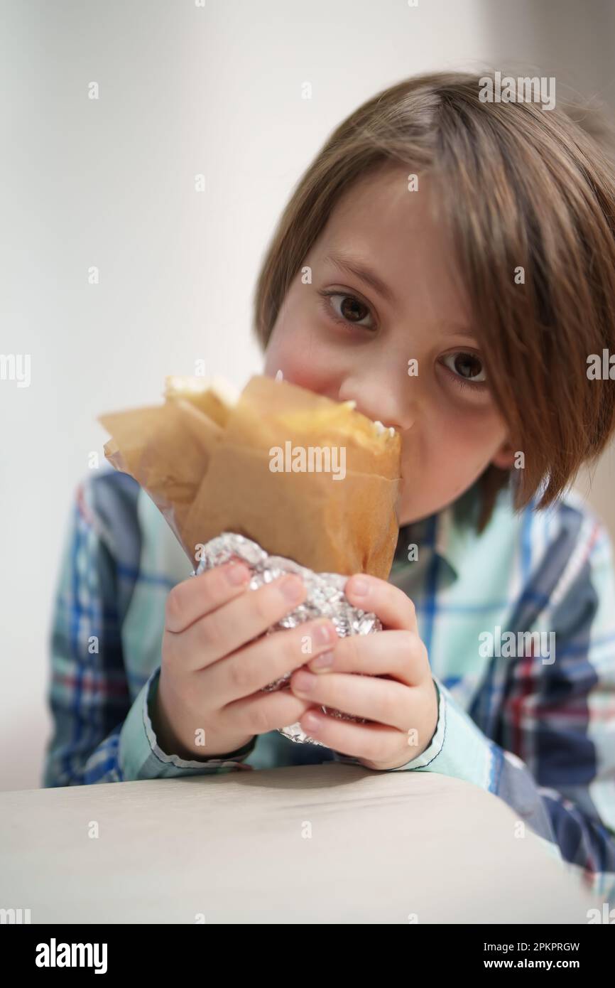 Year old boy eating sandwich hi-res stock photography and images - Alamy