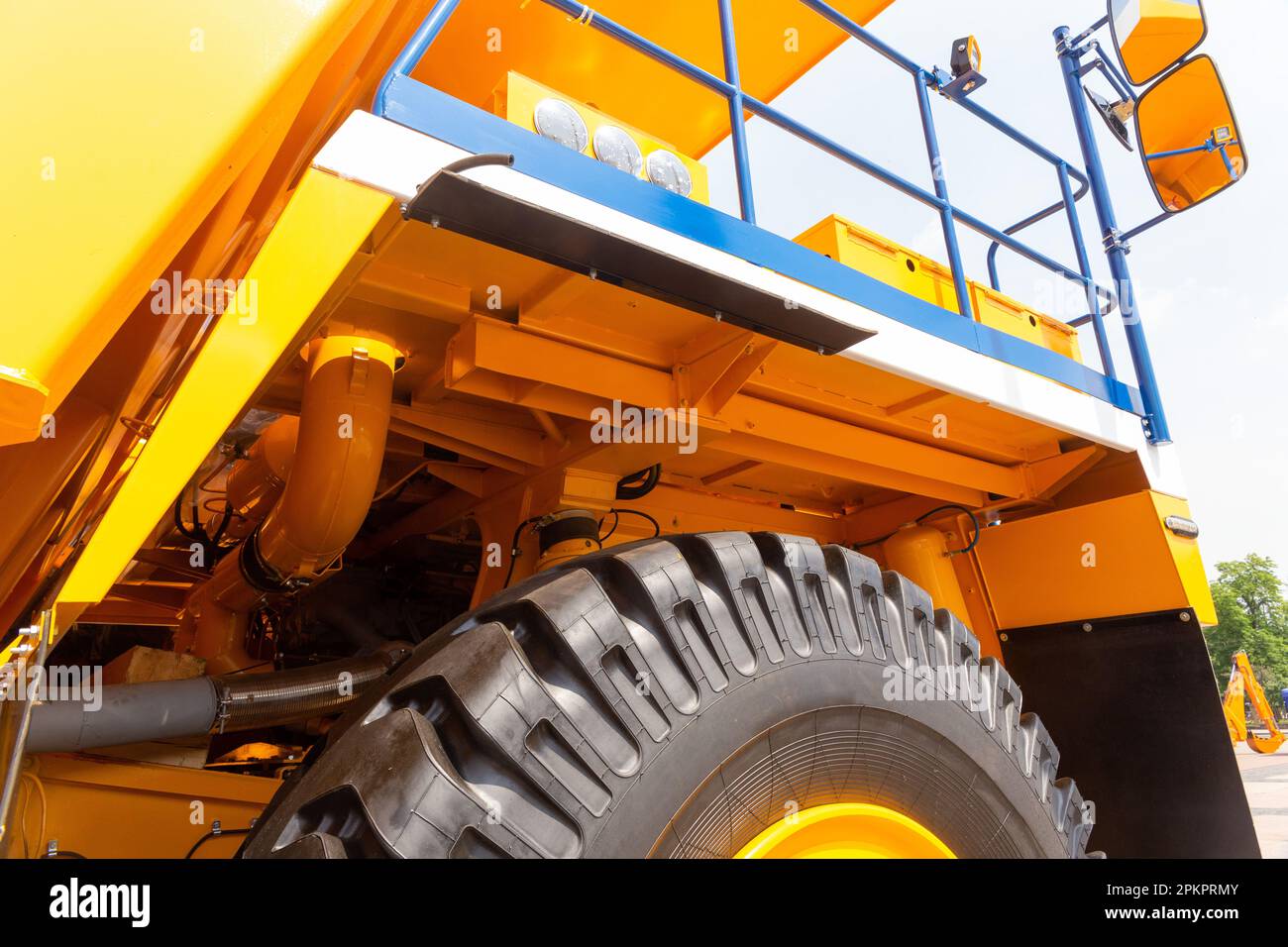 Huge rear wheels of dump truck at unusual angle closeup. The wheels ...