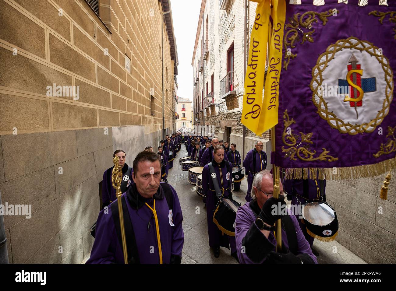 Several people in the procession of a tamborrada heading towards the ...