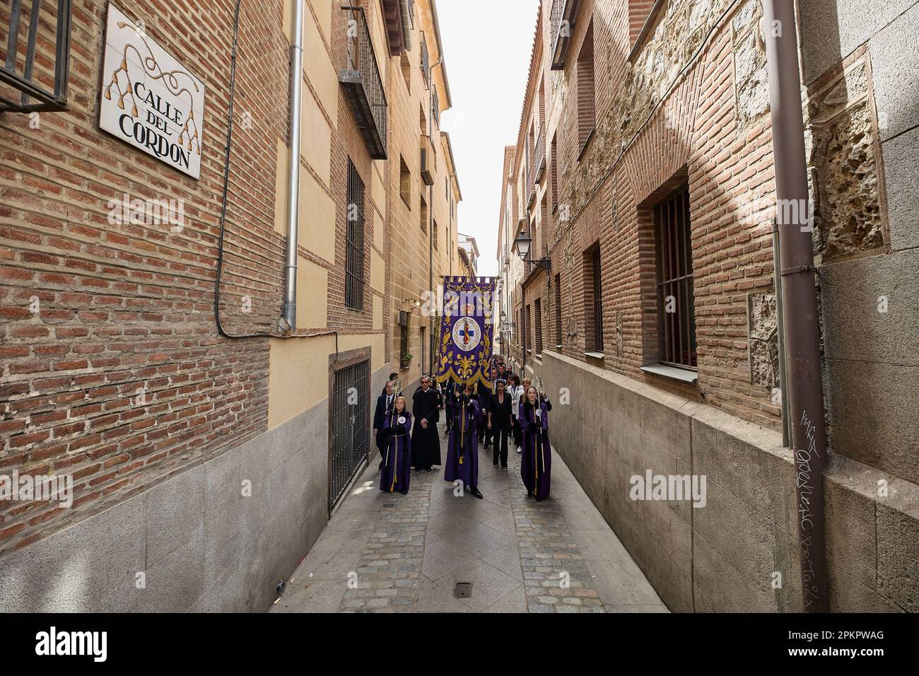 Several people in the procession of a tamborrada heading towards the ...