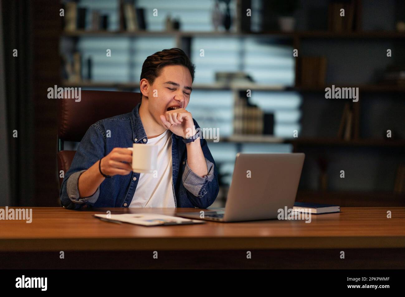 Employee using laptop overworking hi-res stock photography and images ...