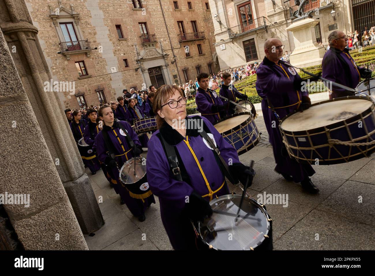 Several people in the procession of a tamborrada heading towards the ...