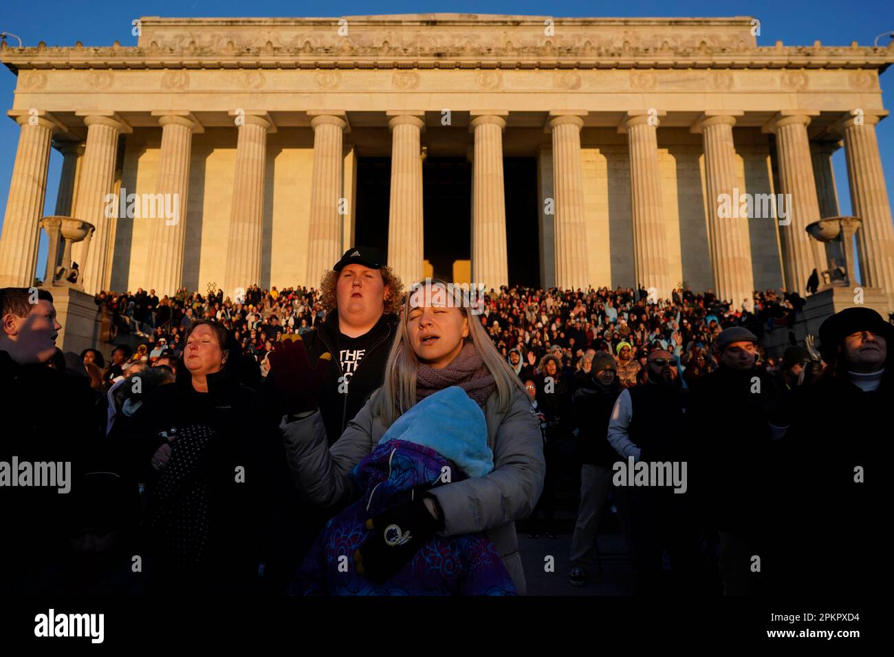 People gather and sing songs of worship during an "Easter Sunrise Service" at the Lincoln ...