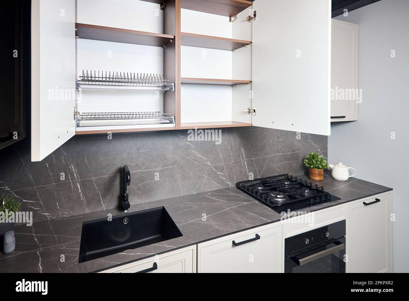 Interior of white and grey kitchen, horizontal linear layout. Luxury ...