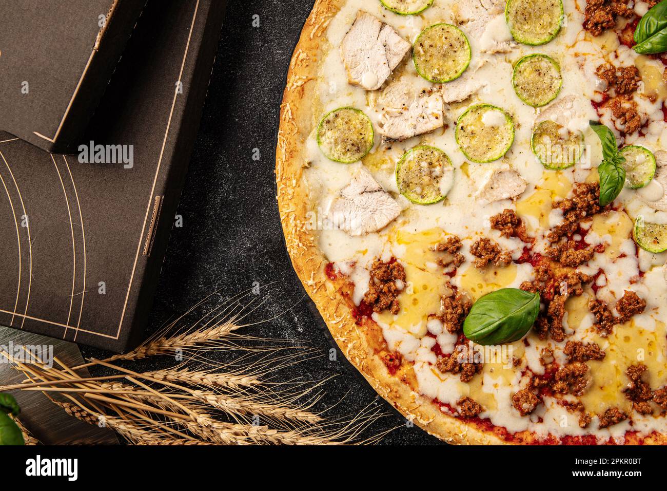 Big assorted pizza with variety of toppings Stock Photo - Alamy