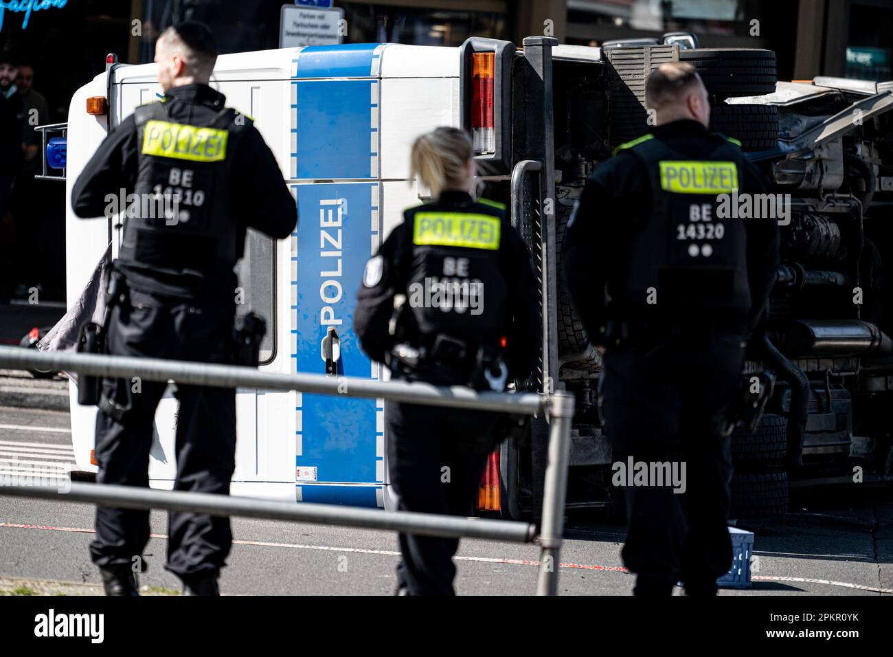 Berlin, Germany. 09th Apr, 2023. An overturned police vehicle lies on ...