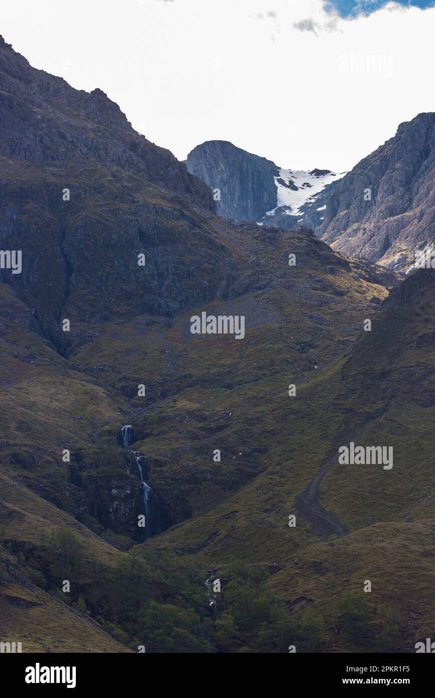 The craggy cliffs of Coire nan Lochan, with the last snow of the season ...