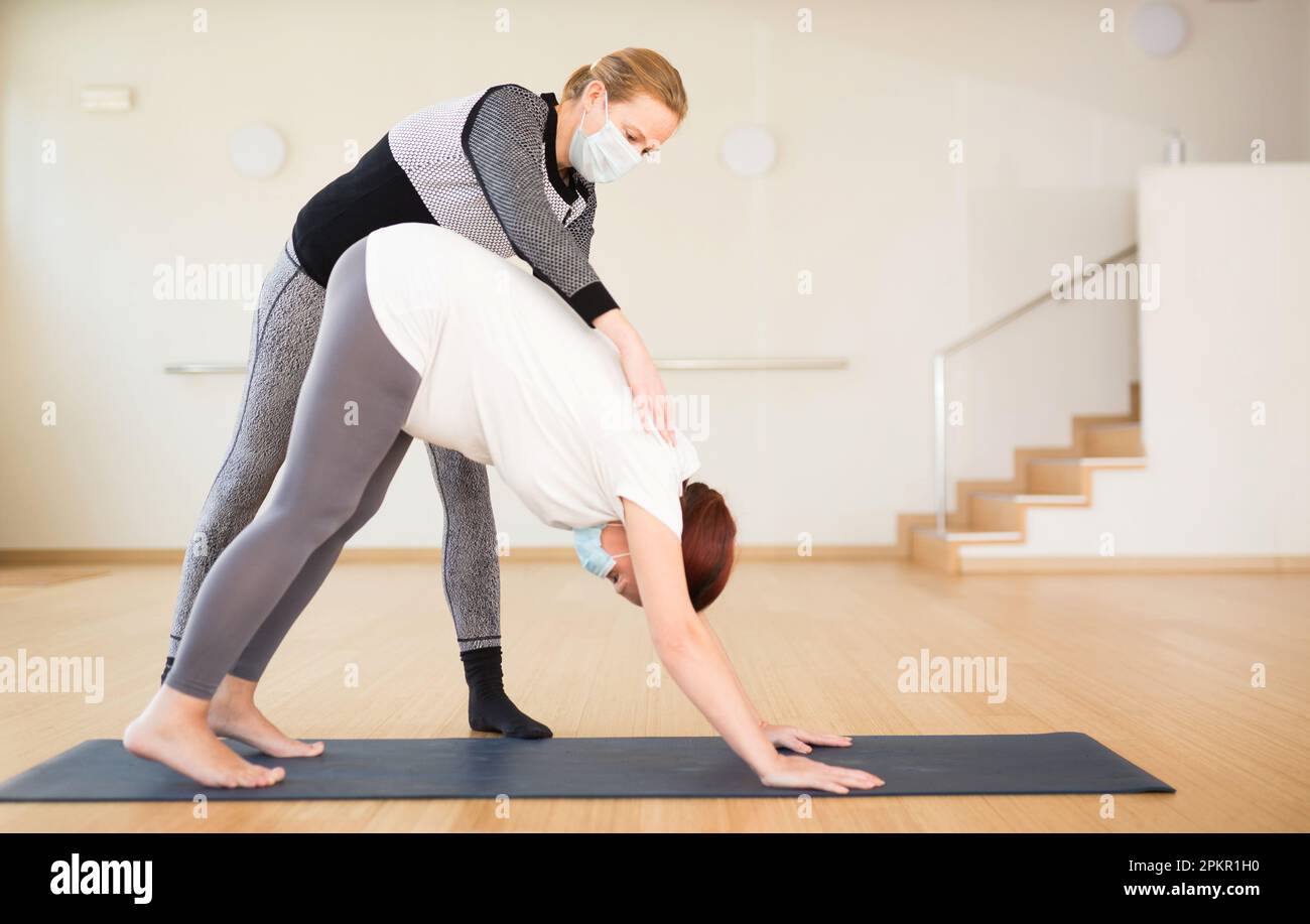 Female yoga instructor in hall hi-res stock photography and images - Alamy