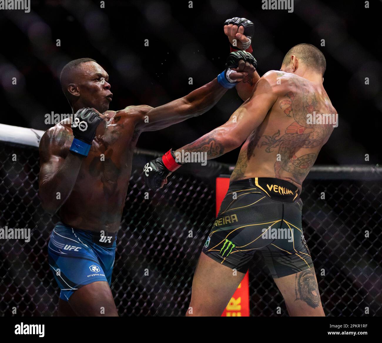Israel Adesanya, left, and Alex Pereira fight in their middleweight ...