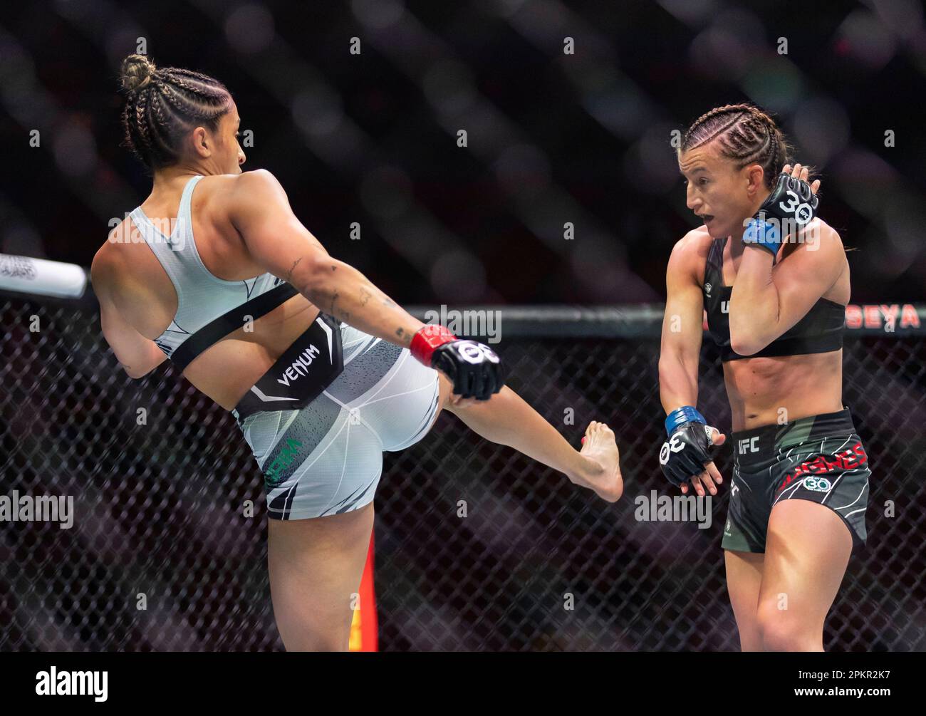 Sam Hughes, right, and Jaqueline Amorim fight during their straw weight ...