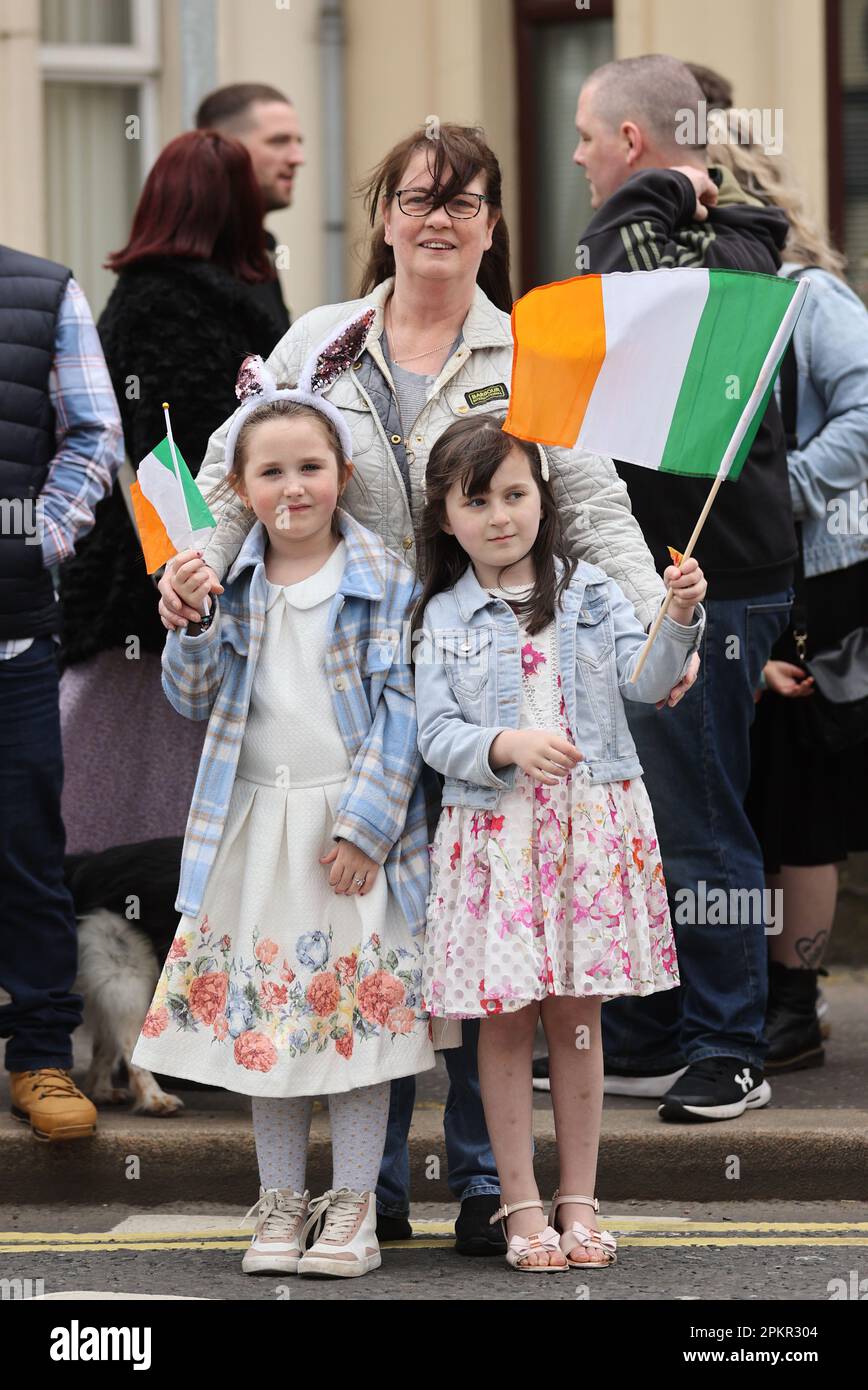 People watch the parade organised by Sinn Fein as it makes its way to ...