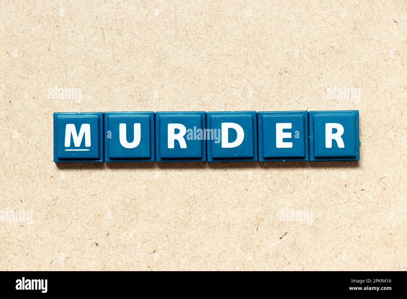 Tile alphabet letter in word murder on wood background Stock Photo - Alamy