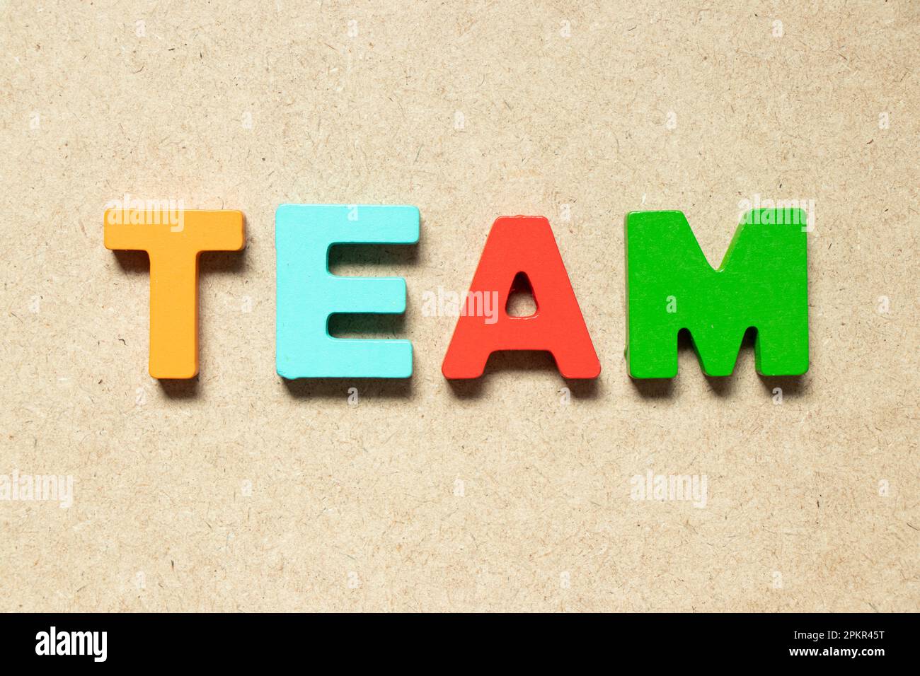Color alphabet letter in word team on wood background Stock Photo - Alamy