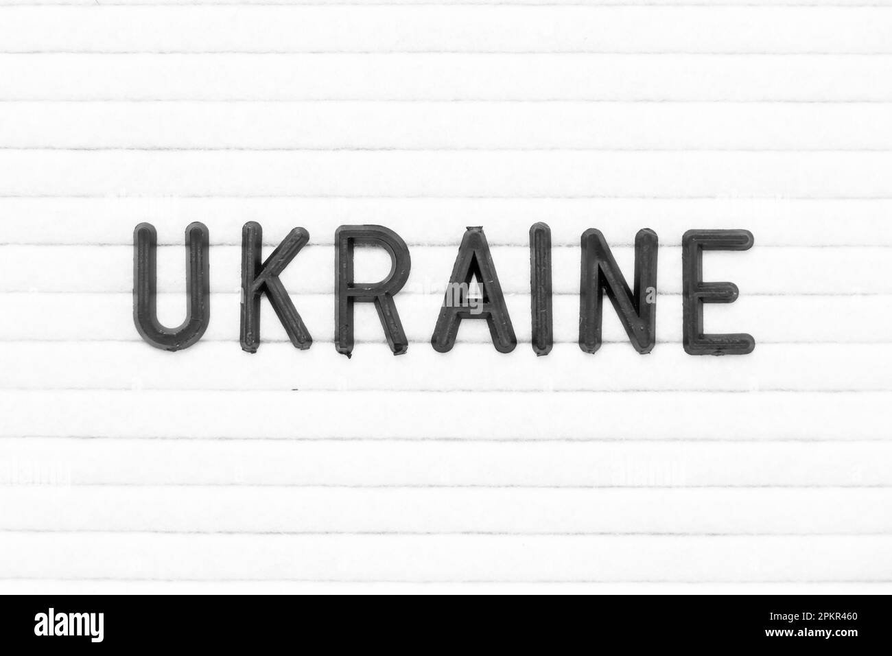 Black color letter in word ukraine on white felt board background Stock ...