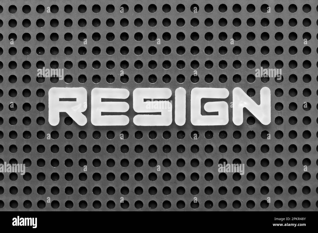White alphabet letter in word resign on black pegboard background Stock ...