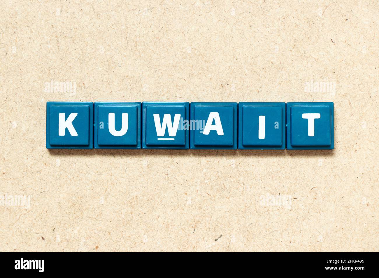 Tile alphabet letter in word kuwait on wood background Stock Photo - Alamy