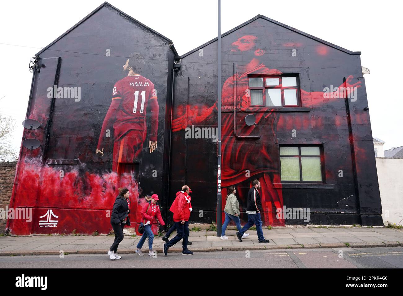 Liverpool fans make their way to the ground before the Premier League ...