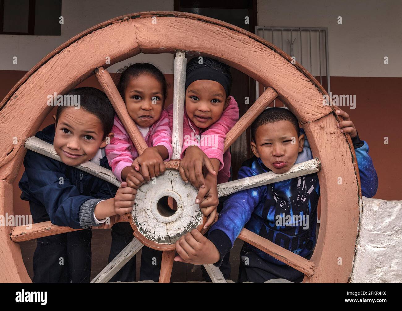 Children of the Eksteenfontein Primary School pose with a painted ox ...