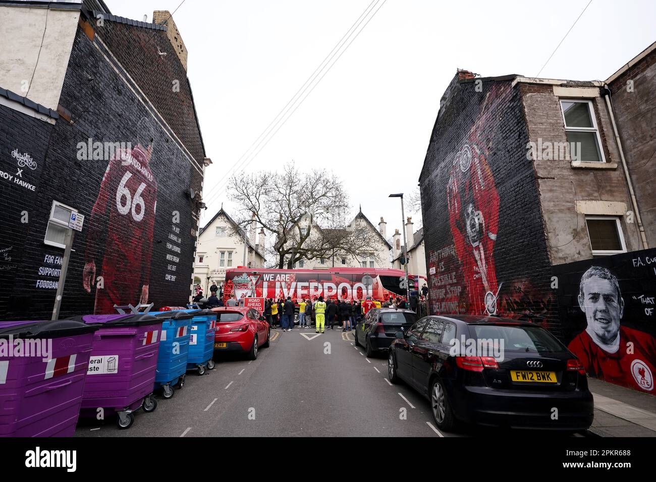 The Liverpool team bus is seen passing player murals on Sybil Road as ...