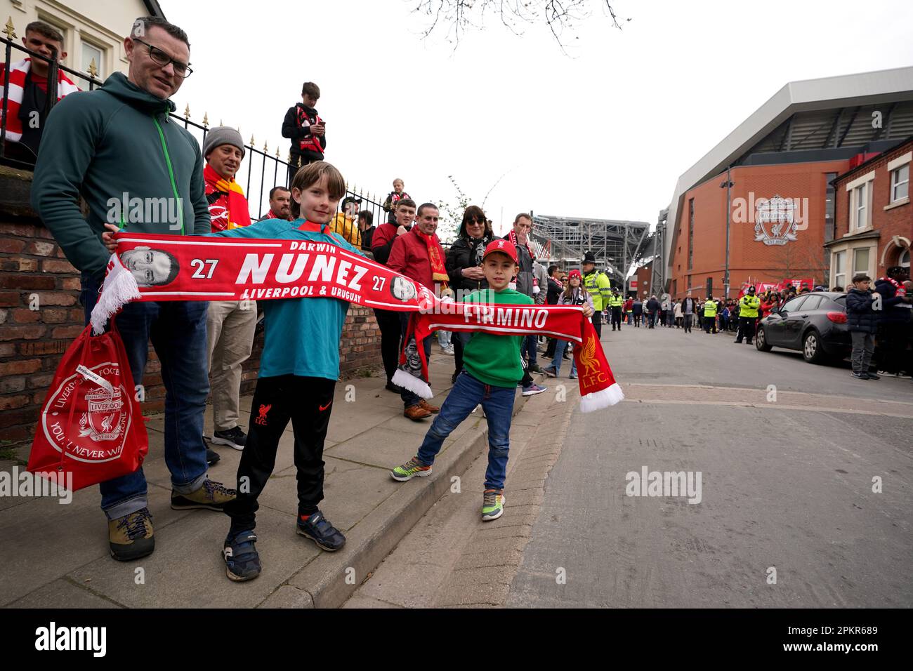 Young Liverpool fans wait for the team bus to arrive before the Premier ...