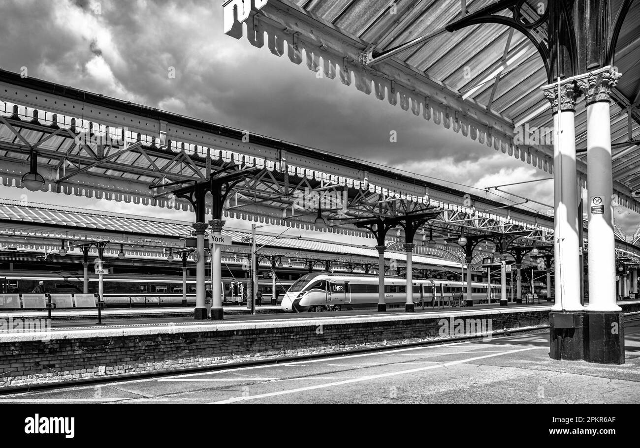 High speed train station in background Black and White Stock Photos ...