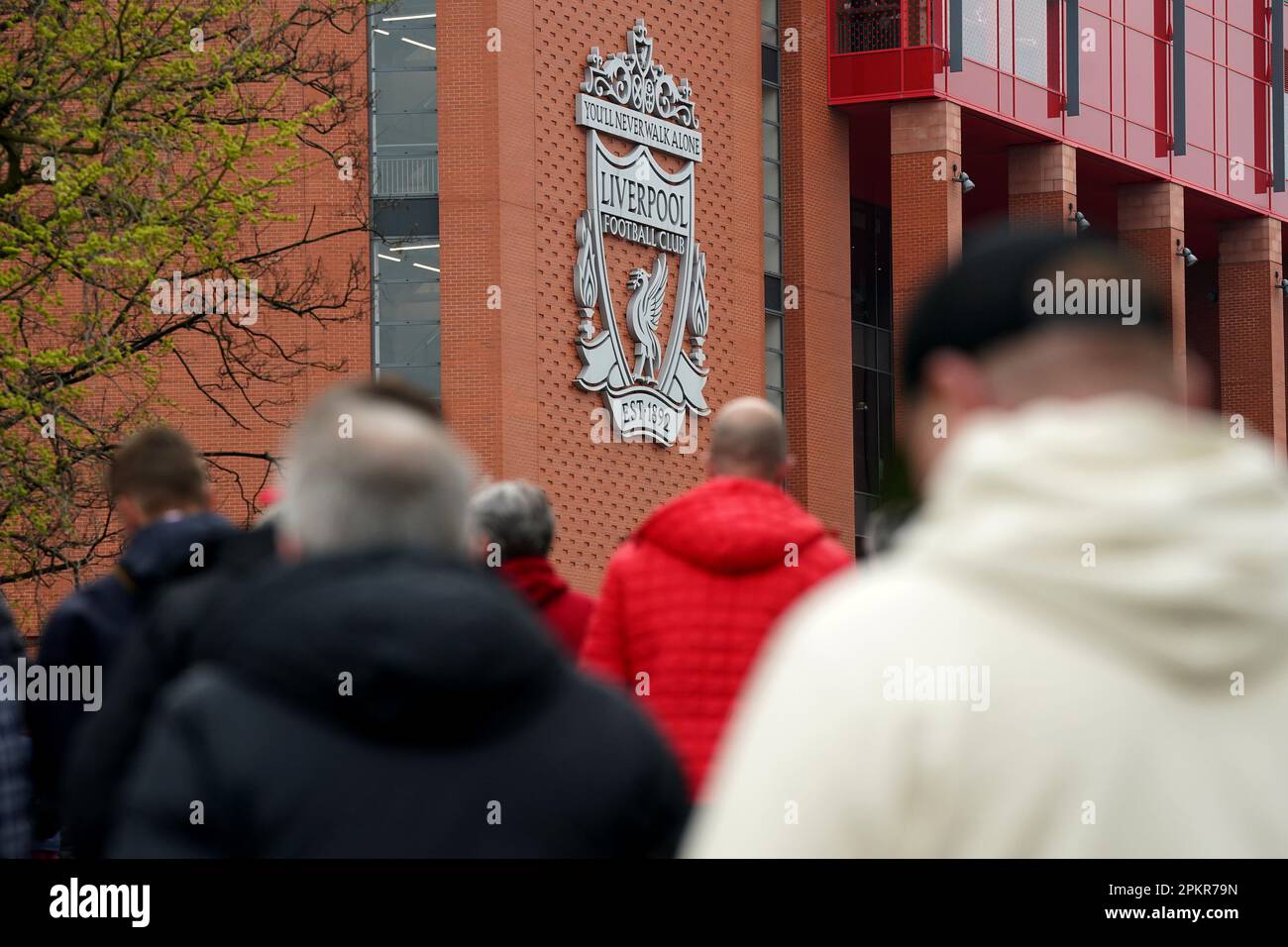 Liverpool fans make their way to the ground before the Premier League ...