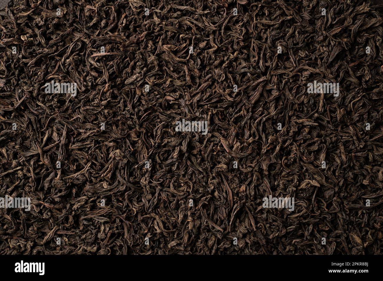 Background of black loose-leaf tea. Close up, top view Stock Photo - Alamy
