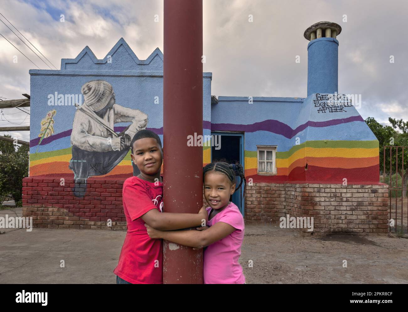 Nazli and his sister Jeandré stand in front of their home in Happy ...