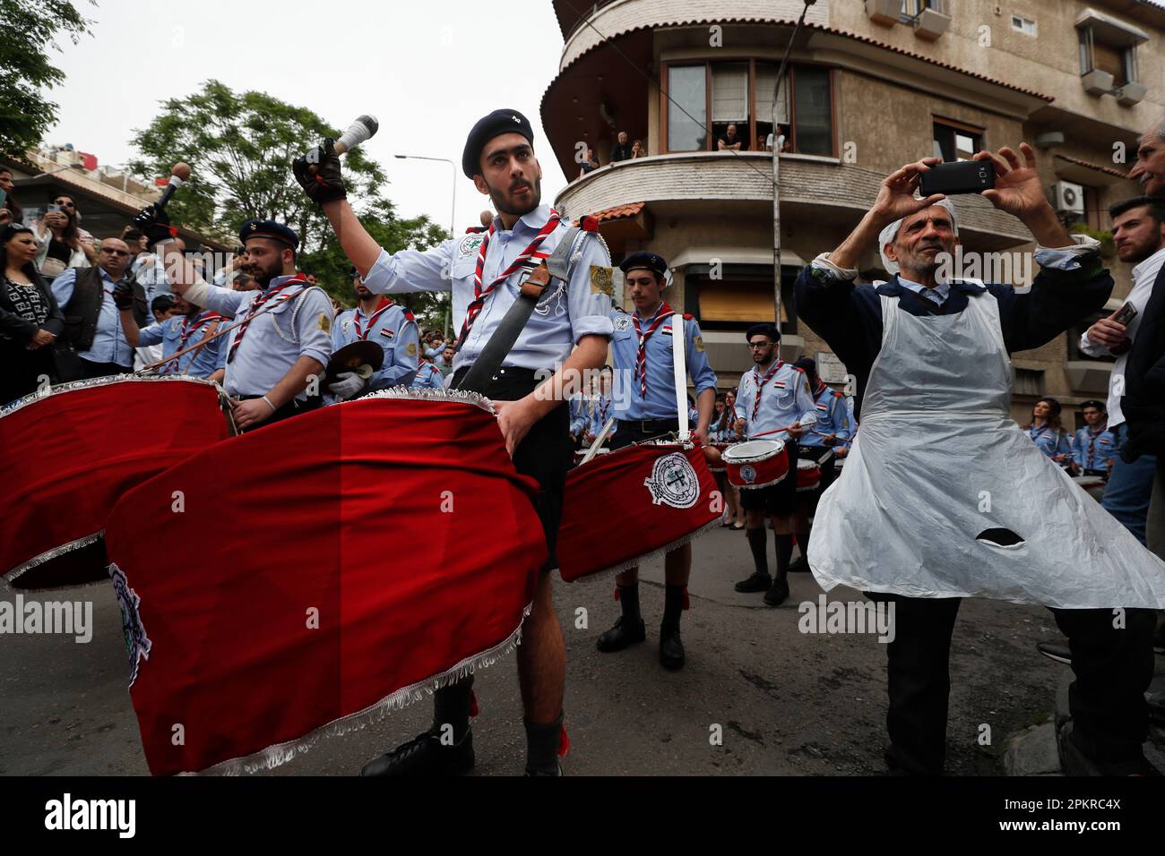 People watch scout band march during Easter parade in Damascus, Syria ...