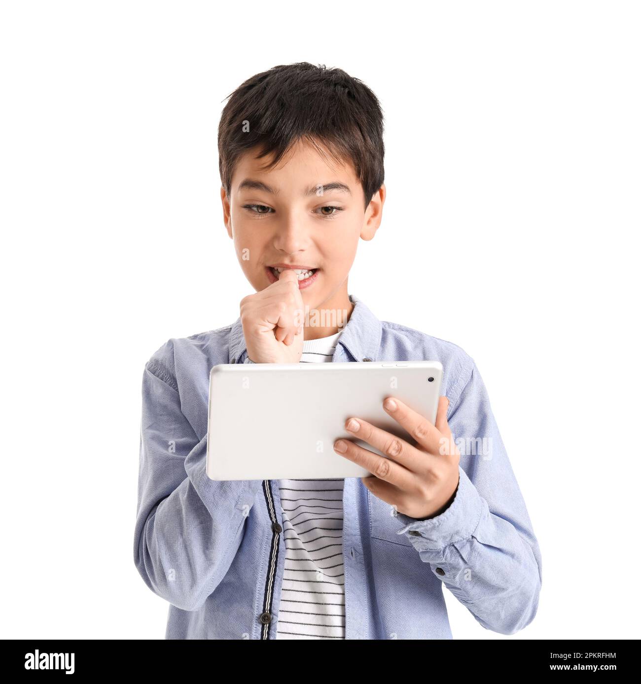 Little boy with tablet computer biting nails on white background Stock ...