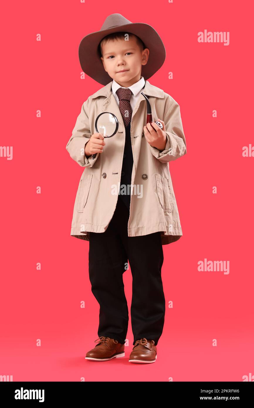 Cute little detective with magnifier and smoking pipe on red background ...