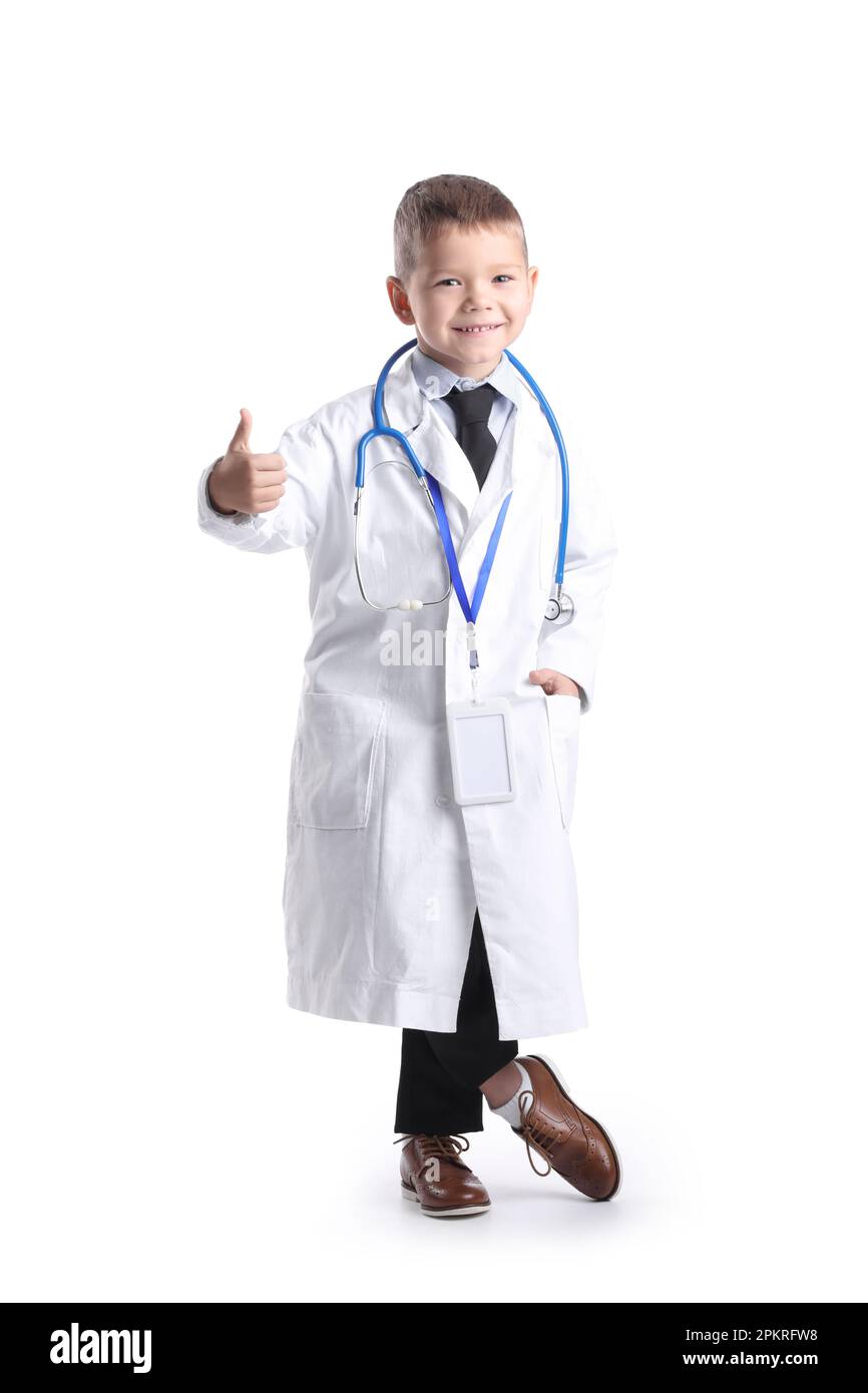 Cute little doctor showing thumb-up on white background Stock Photo - Alamy
