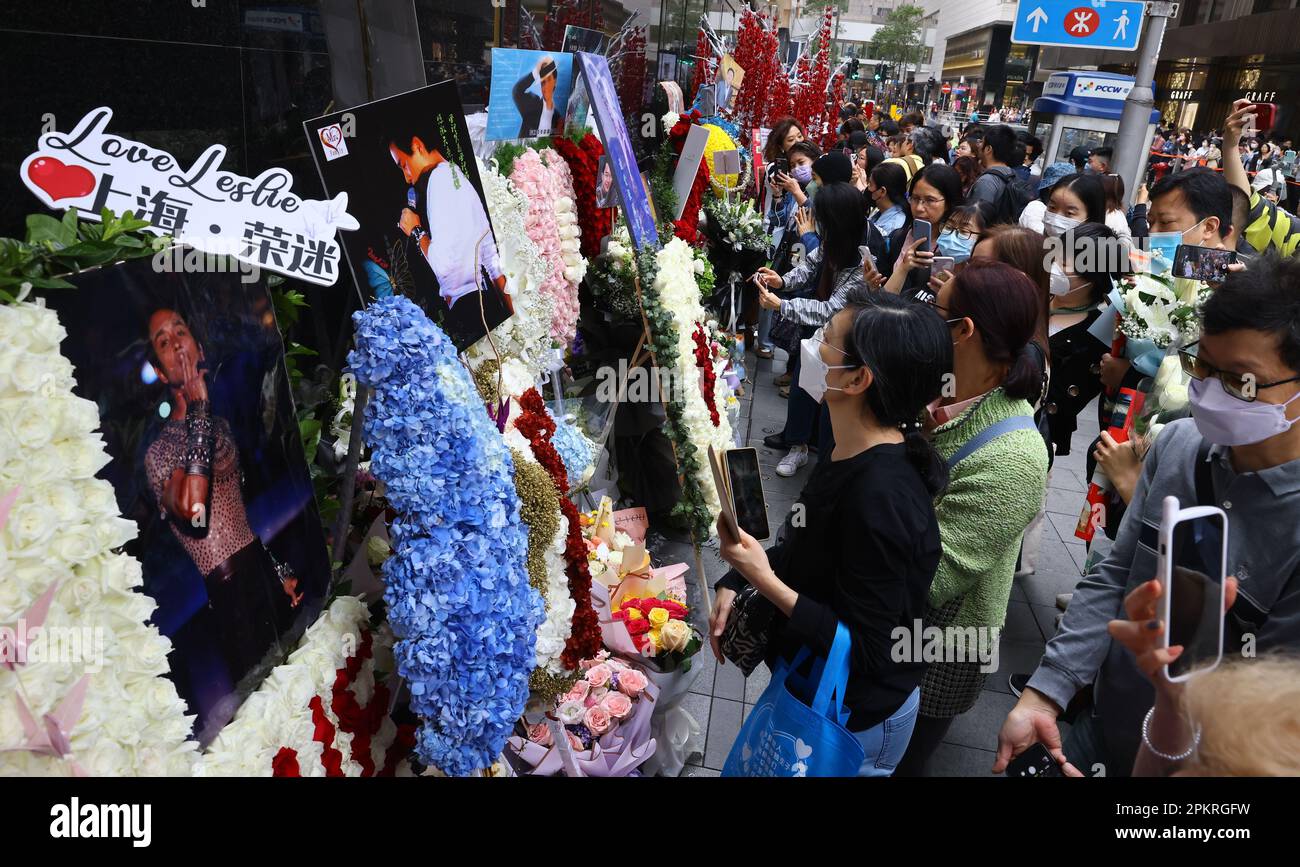Fans lay flowers and photos of late Canto-pop star Leslie Cheung Kwok ...