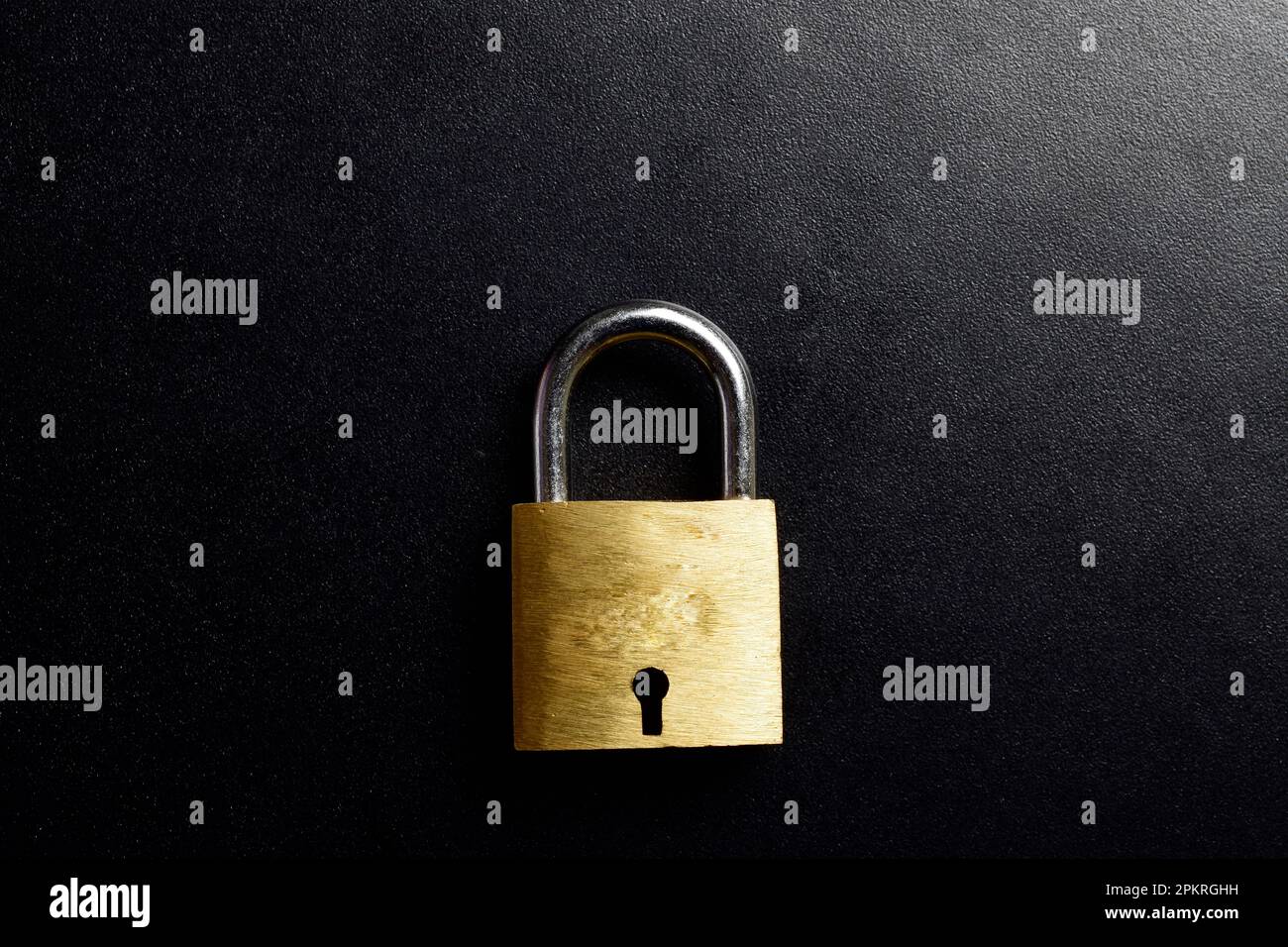 Top view of copper lock on dark background Stock Photo - Alamy