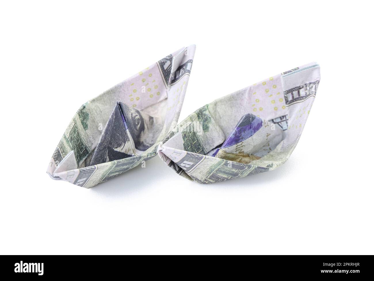 Origami boats made of dollar banknotes on white background Stock Photo ...