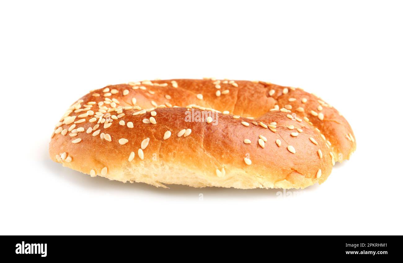 Half of tasty bagel with sesame seeds on white background Stock Photo ...