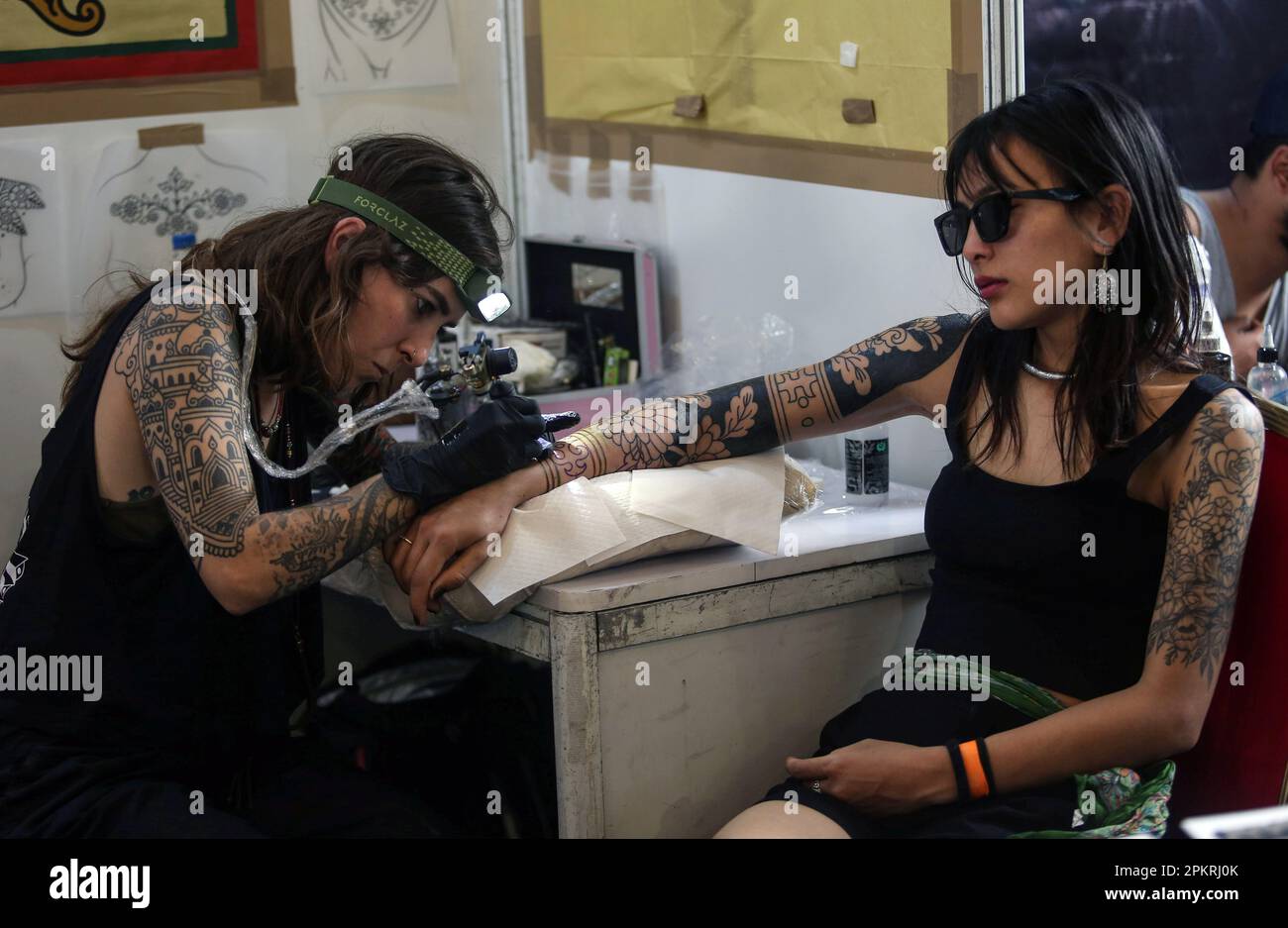 Lalitpur, Bagmati, Nepal. 9th Apr, 2023. A tattoo artist inks a ...