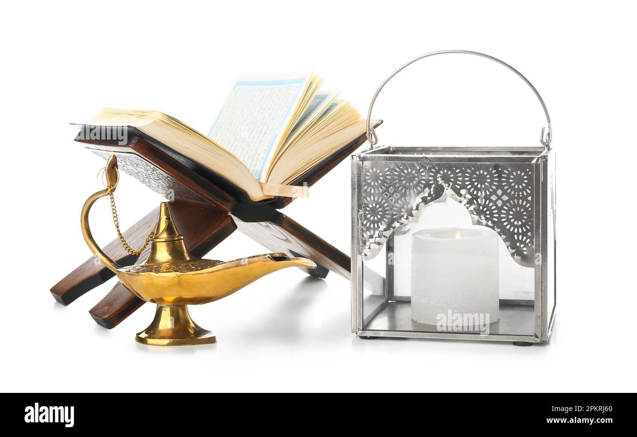 Muslim lantern with Aladdin lamp and Koran on white background Stock ...