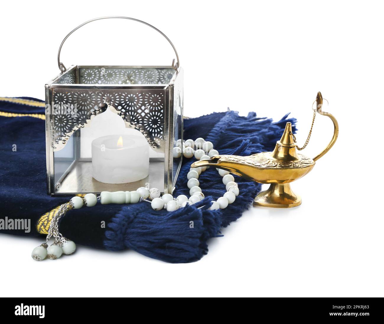 Muslim lantern with Aladdin lamp, prayer beads and mat on white ...